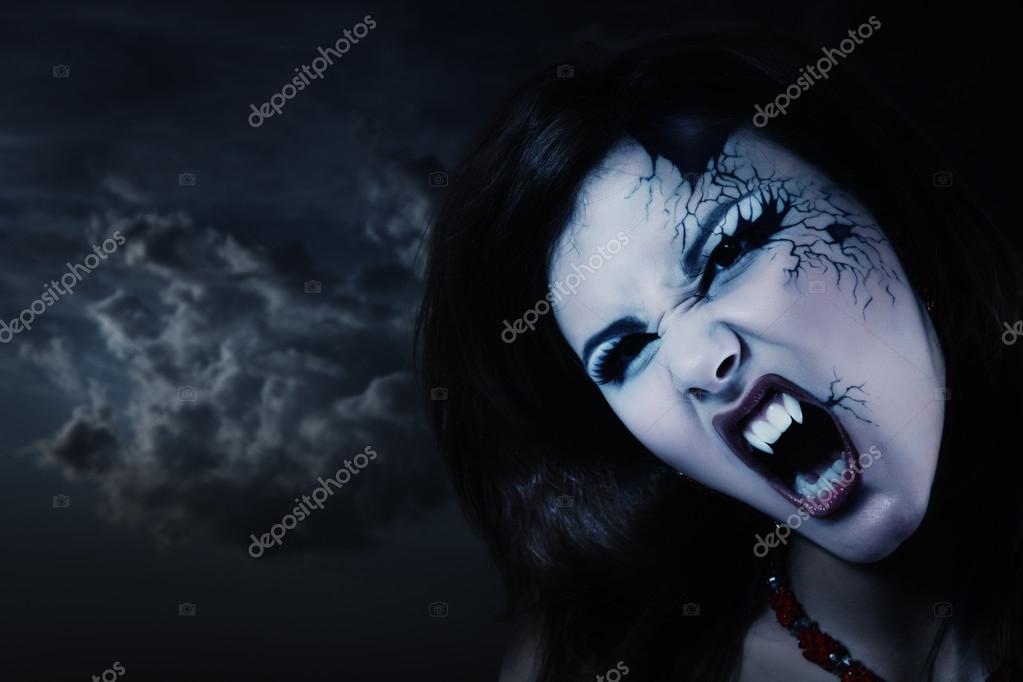 Evil vampire woman beautiful halloween over night background Stock ...
