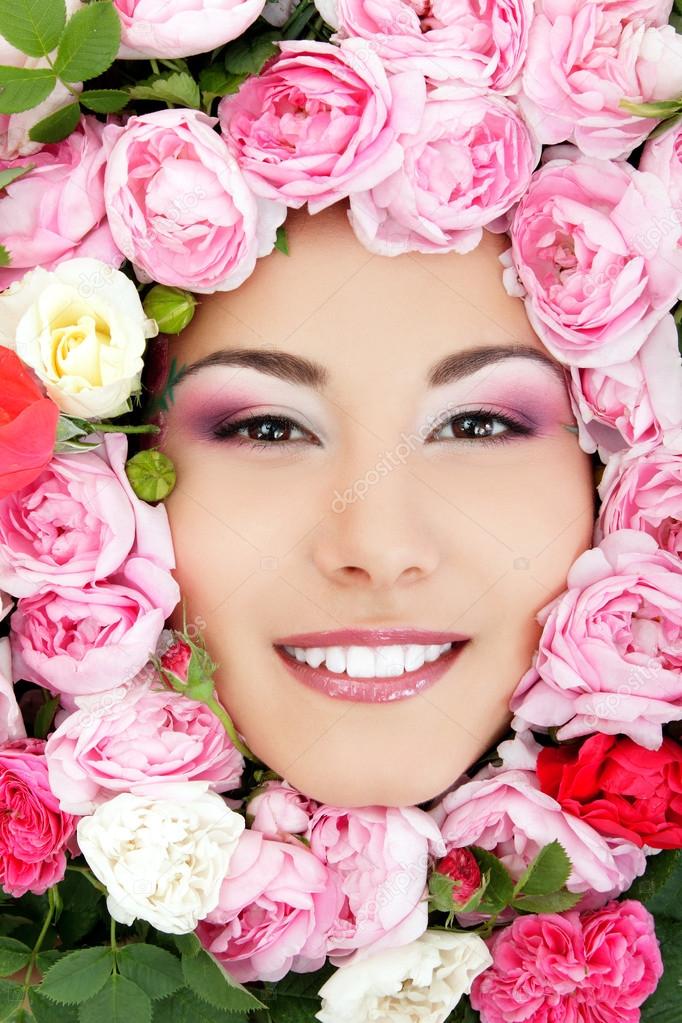 Beautiful female face with flowers roses frame — Stock Photo ...