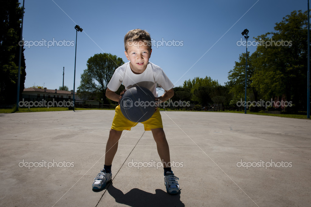 Little boy playing basketball Stock Photo by ©stefanolunardi 12354821