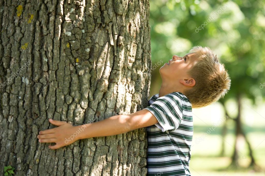Boy hugging a tree Stock Photo by ©stefanolunardi 44705811