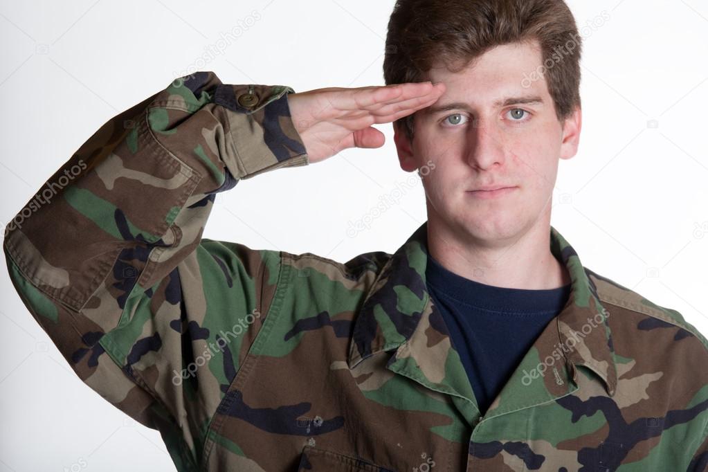 Young soldier saluting Stock Photo by ©GunterNezhoda 24076329