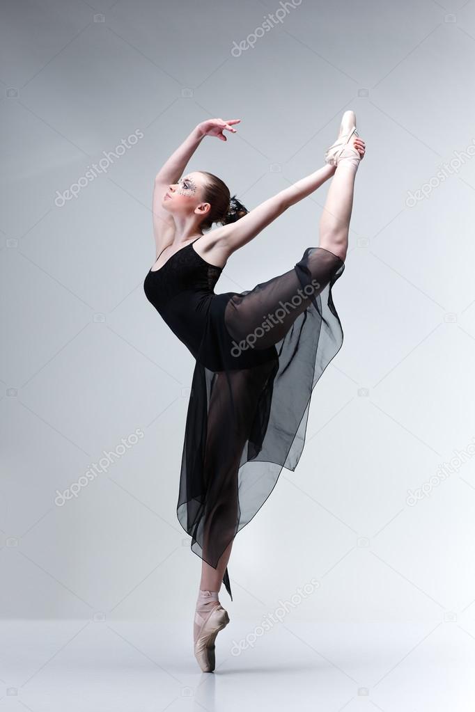 Beautiful ballet-dancer, modern style dancer posing on studio ...