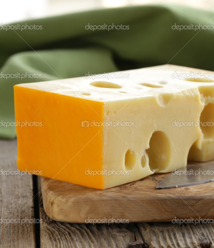 Piece of cheese Maasdam on a wooden board ⬇ Stock Photo, Image by ...