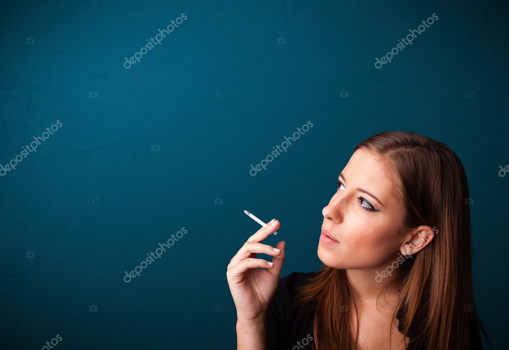 Beautiful woman smoking cigarette vith copy space — Stock Photo ...