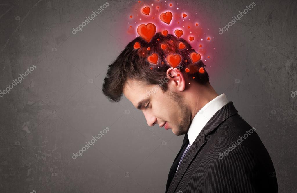 Young person thinking about love with red hearts — Stock Photo ...