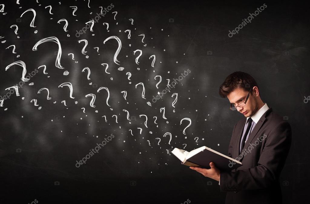 Young man reading a book with question marks coming out from it — Stock ...