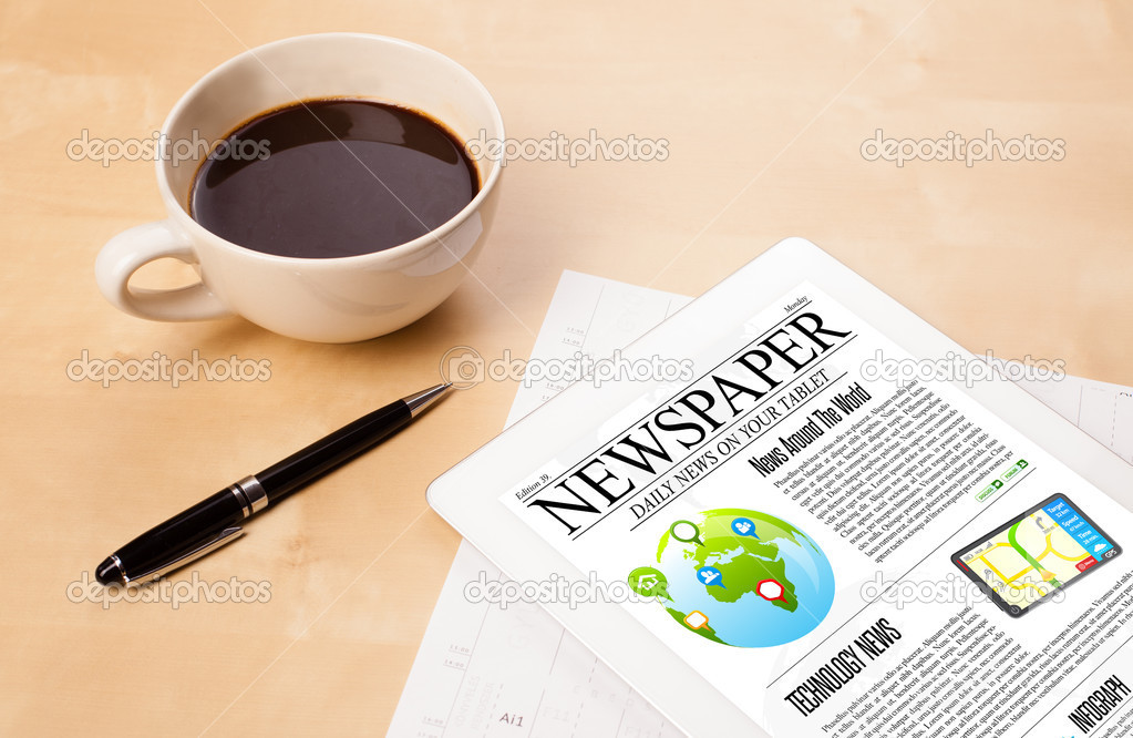 Tablet pc shows news on screen with a cup of coffee on a desk — Stock ...