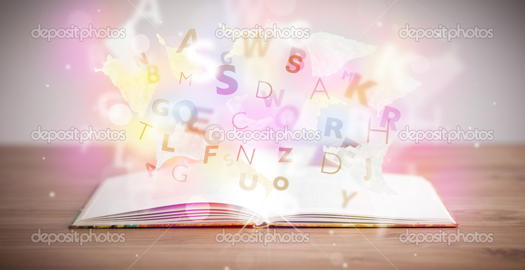 Open book with glowing letters on concrete background — Stock Photo ...