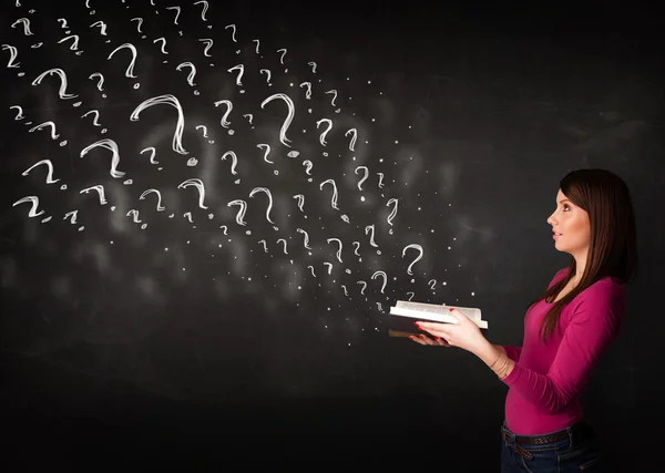 Pretty woman reading a book with question marks coming out from Stock ...