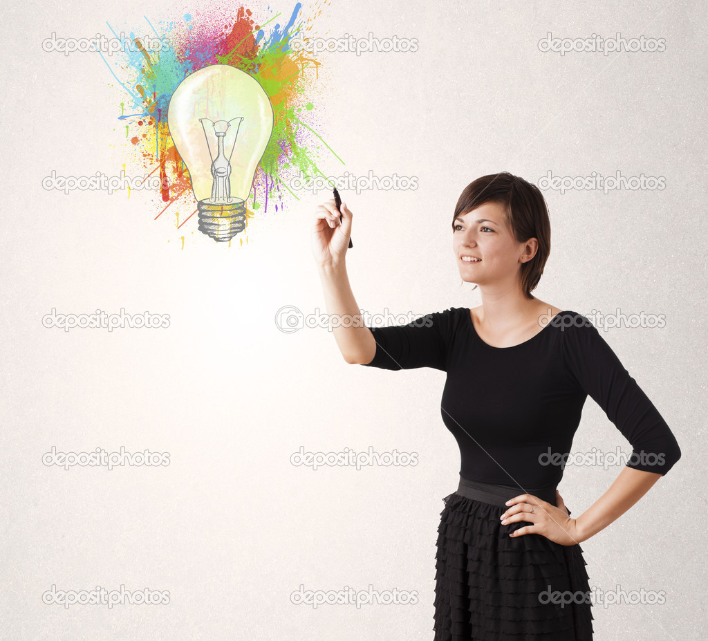 Young lady drawing a colorful light bulb with colorful splashes Stock ...