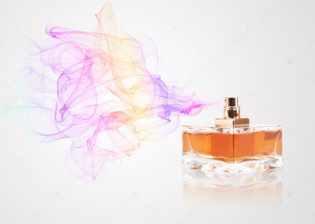 Perfume bottle spraying colored scent Stock Photo by ©ra2studio 38373027