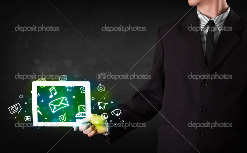 Person holding a tablet with media icons and symbols — Stock Photo ...