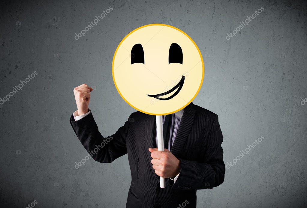 Businessman holding a smiley face emoticon — Stock Photo © ra2studio ...