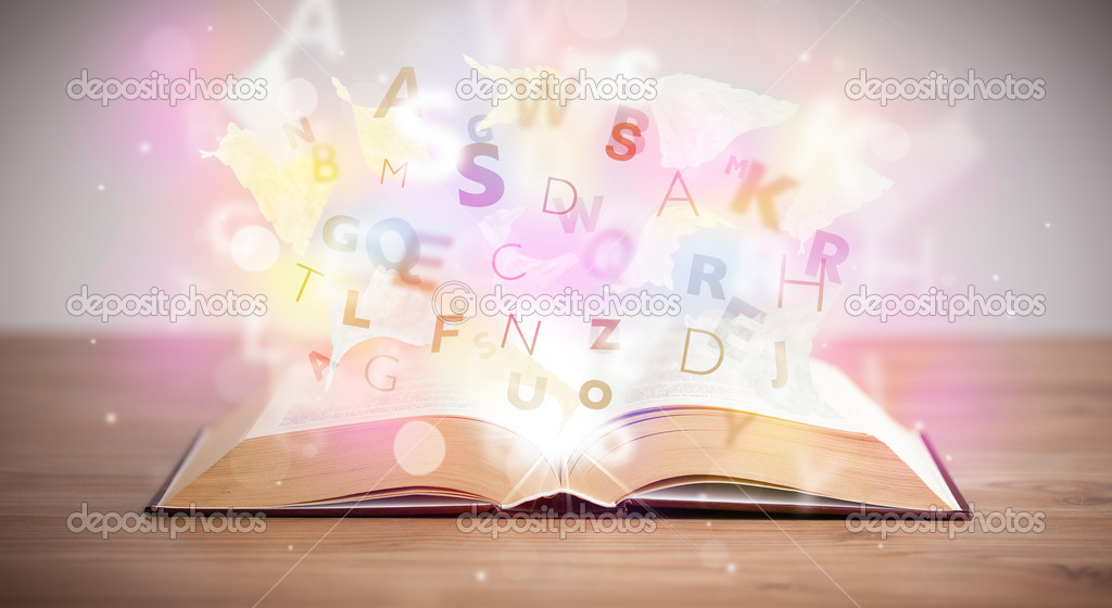 Open book with glowing letters on concrete background — Stock Photo ...
