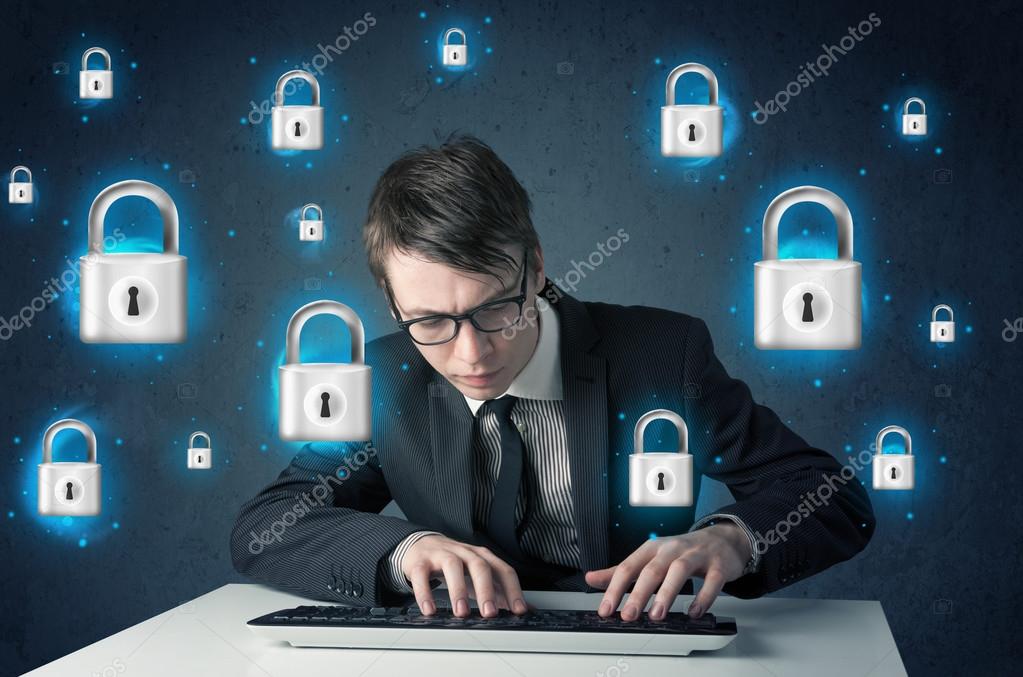 Young hacker with virtual lock symbols and icons Stock Photo by ...