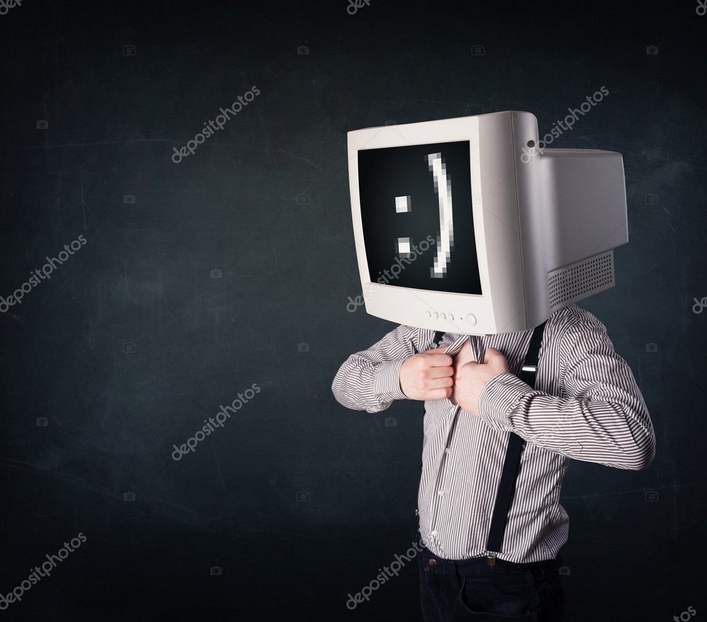 Funny young businessman with a monitor on his head and smiley on ...