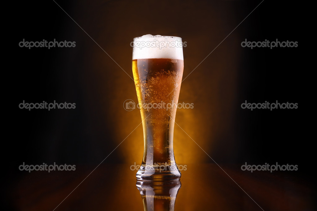 Glass of light beer Stock Photo by ©hiddenhallow 49621569