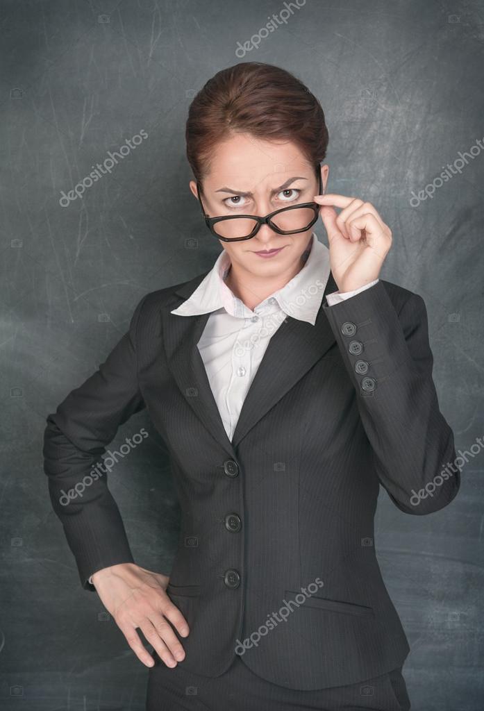 Strict teacher looking at someone — Stock Photo © DarkBird #29175555