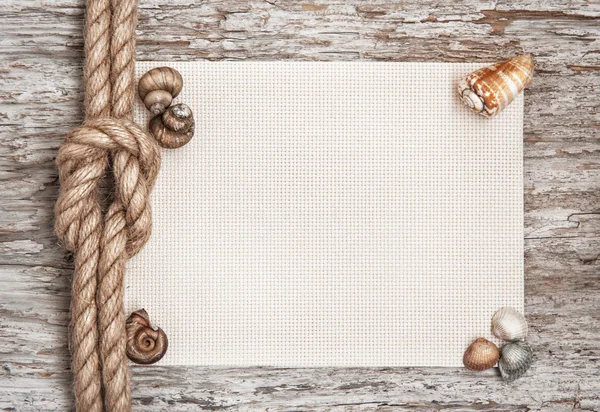 Ship rope, shells and wood background — Stock Photo © DarkBird #31627667