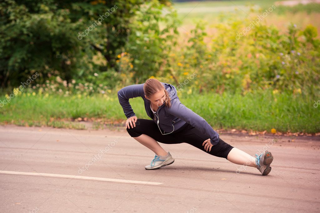 Runner woman stretching in nature outdoor ⬇ Stock Photo, Image by ...