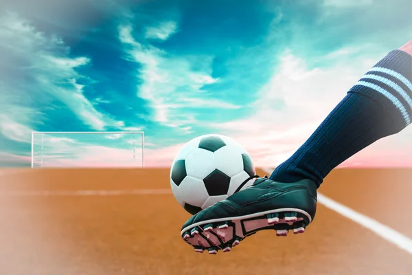 Foot kicking soccer ball Stock Photo by ©tungphoto 27540373
