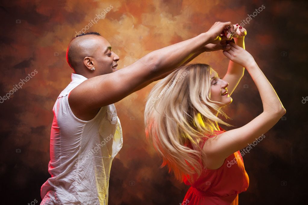 Young couple dances Caribbean Salsa — Stock Photo © IgorBorodin #42260993