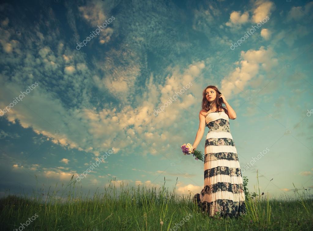 Young woman and sunset sky — Stock Photo © blazeofglory #35537765
