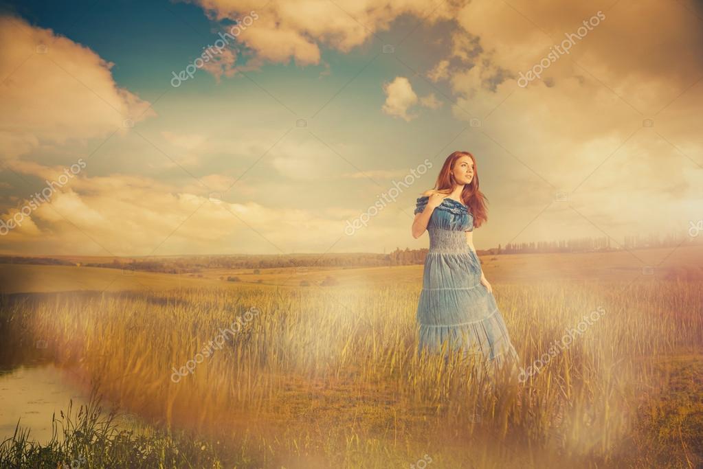 Young lady at sunset field — Stock Photo © blazeofglory #35537823