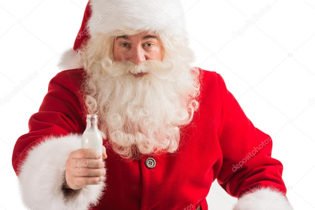 Santa Claus drinking milk from bottle — Stock Photo © HASLOO #31418007