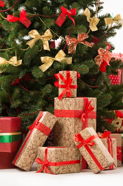 Beautiful christmas tree with gift boxes and shopping bags Stock Photo ...