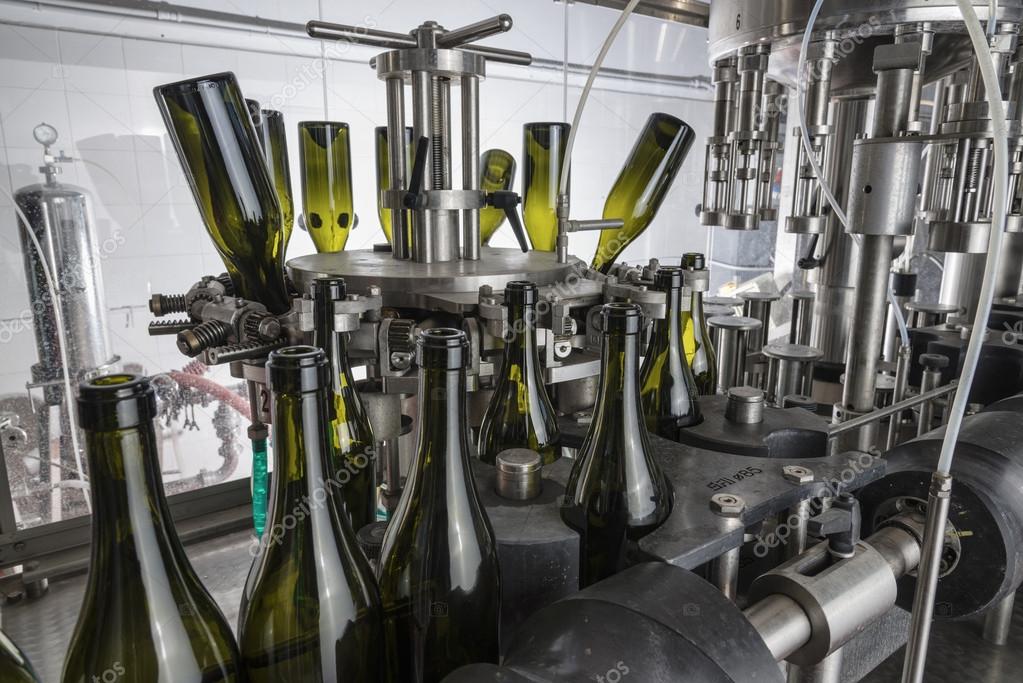 Italy, Sicily, wine bottles ready to be washed and filled with wine by ...