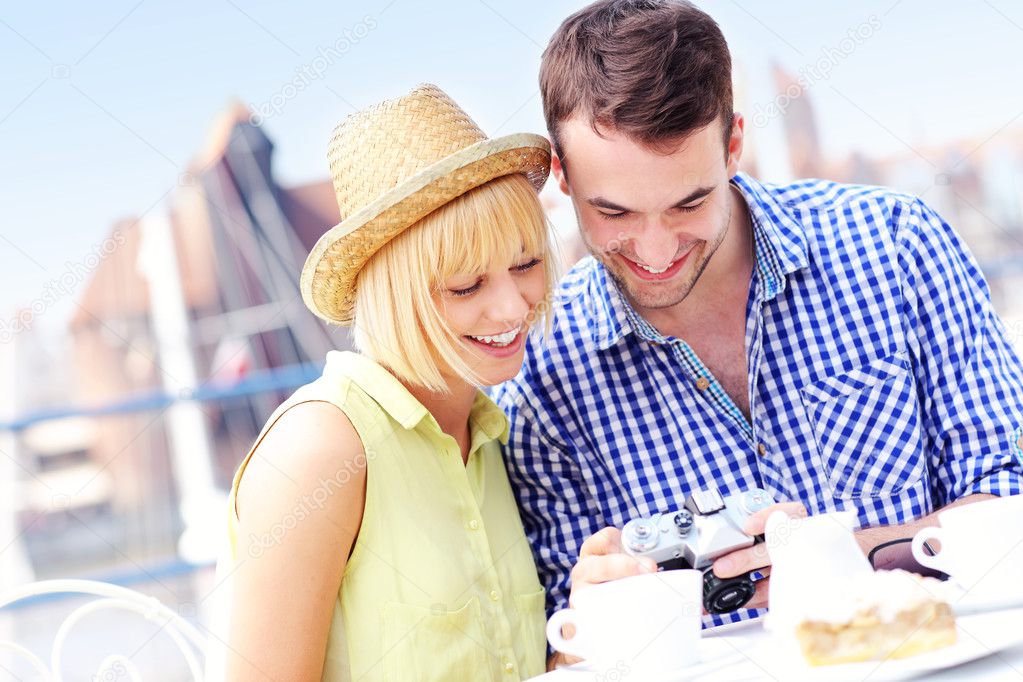 Happy tourists checking their pictures — Stock Photo © macniak #47835671