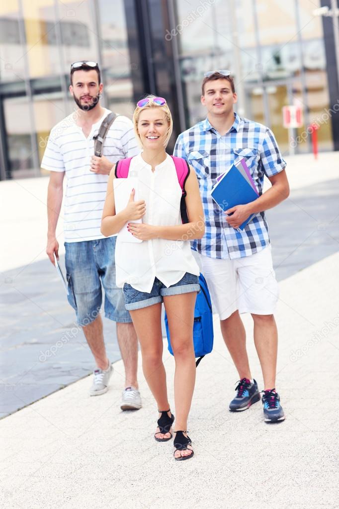 Happy students hanging out in the campus — Stock Photo © macniak #50968613
