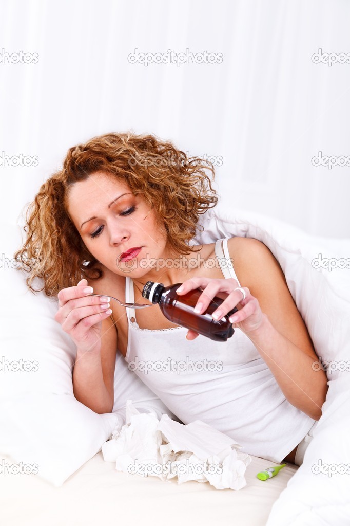 Woman taking syrup — Stock Photo © kalozzolak #20053315