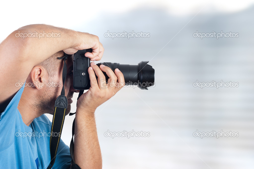 Man with photo camera — Stock Photo © librakv #12720615
