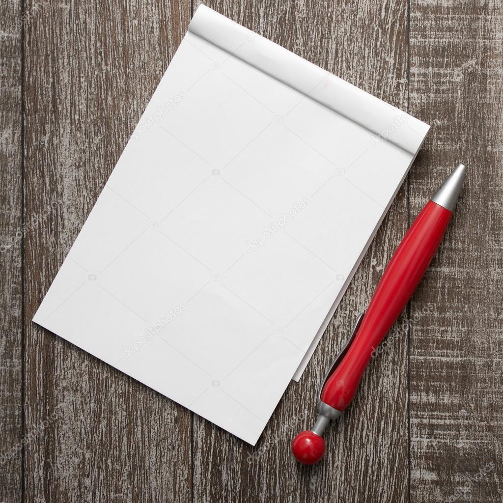 Blank notepad and pen on wooden table Stock Photo by ©librakv 46338571