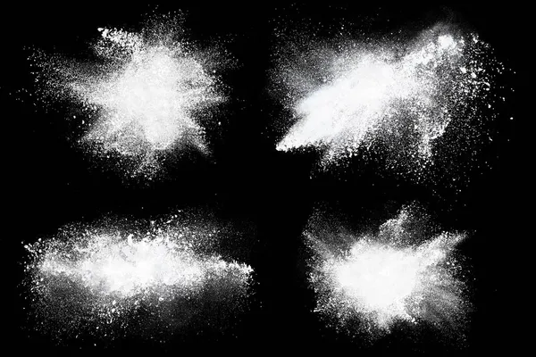 Set of dust powder splash clouds isolated on black. Flour particles ...