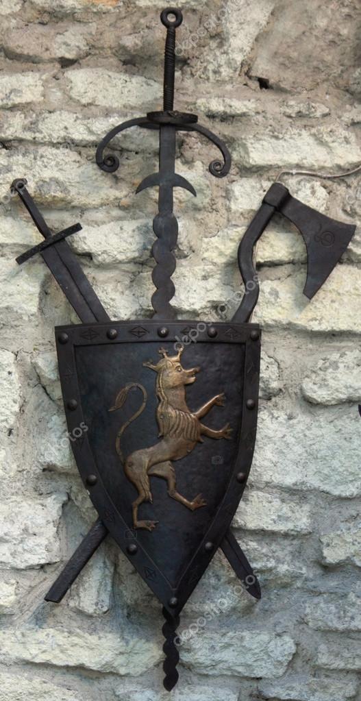 Medieval weapons on a background of ancient wall Stock Photo by ...