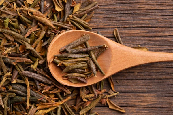 Sagan daila tea leaves close up. Sagan daila tea leaves in a spoon ...
