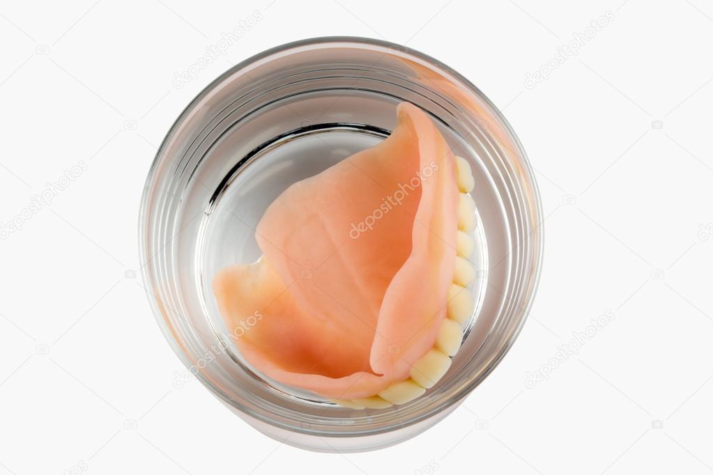 Dentures in a water glass — Stock Photo © ginasanders #26172619