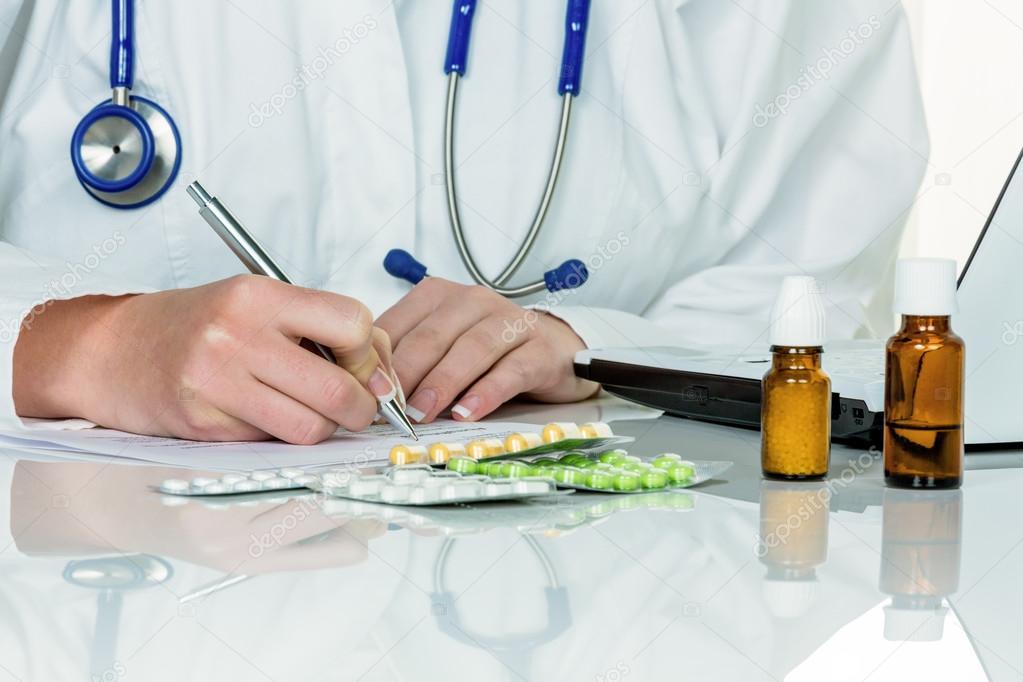 Doctor prescribes a drug — Stock Photo © ginasanders #28015503