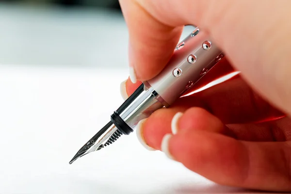 Hand with fountain pen with signature - Stock Image - Everypixel