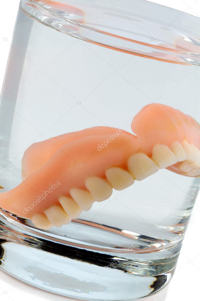 Denture in water glass — Stock Photo © ginasanders #36208255