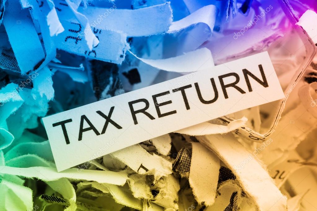 Shredded paper tax return Stock Photo by ©ginasanders 39267465