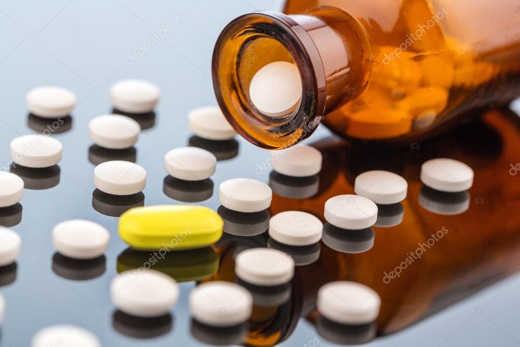 Many tablets with container — Stock Photo © ginasanders #44155543