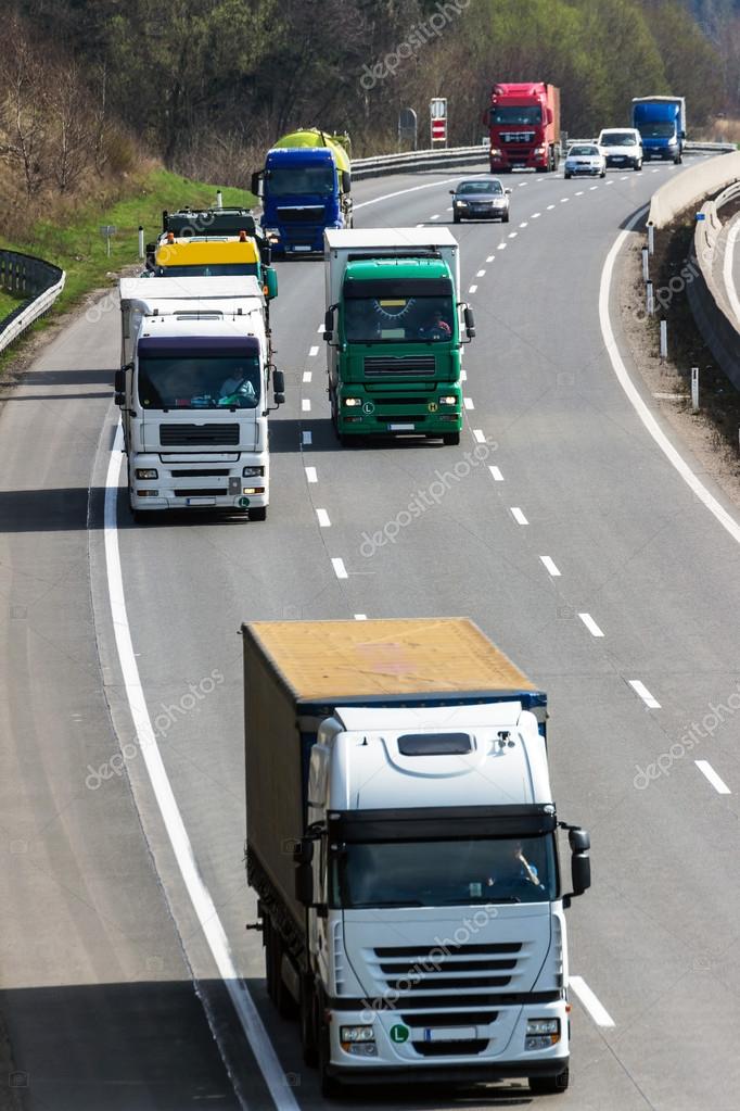 Camiones en la carretera — Foto de stock #45431033 © ginasanders