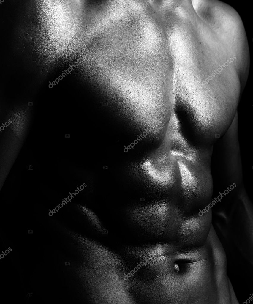 Muscular male torso on black background — Stock Photo © cristovao #12949088