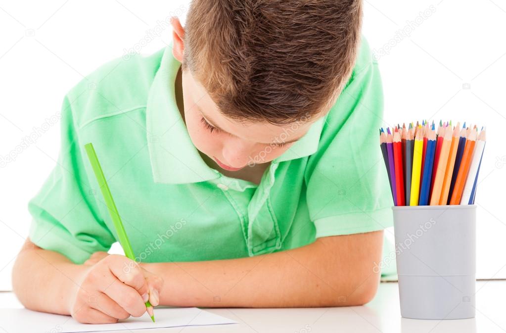 School boy drawing with a pencil on white background Stock Photo by ...