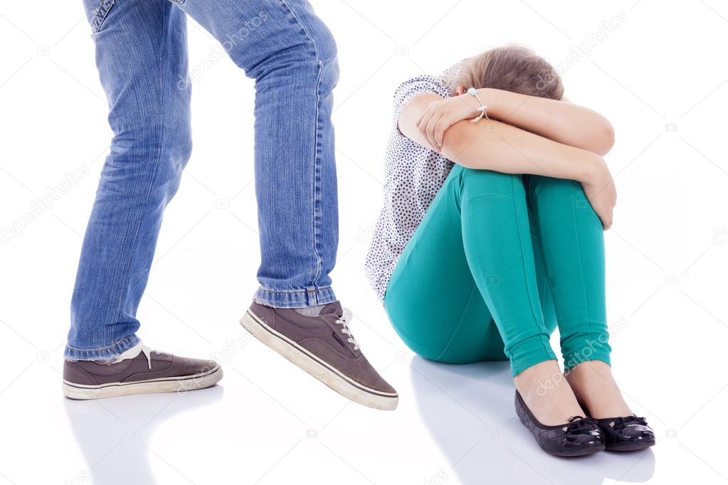 Little girl being kicked by a boy, isolated on white background Stock ...