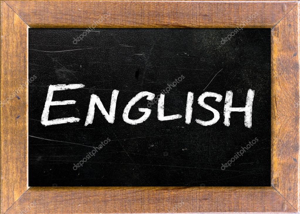 The word English handwritten in white chalk on a used blackboard ...